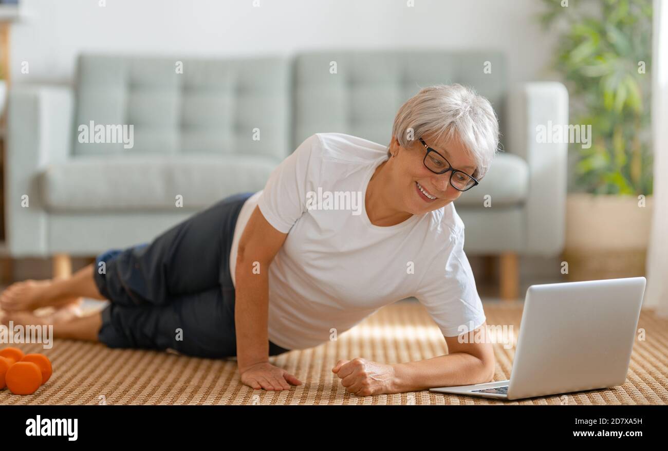 Watching online courses senior hi-res stock photography and images - Alamy