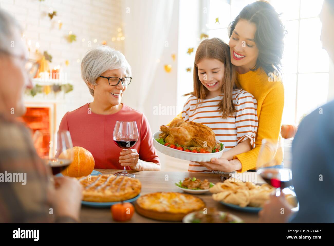 Happy Thanksgiving Day! Autumn feast. Family sitting at the table and ...