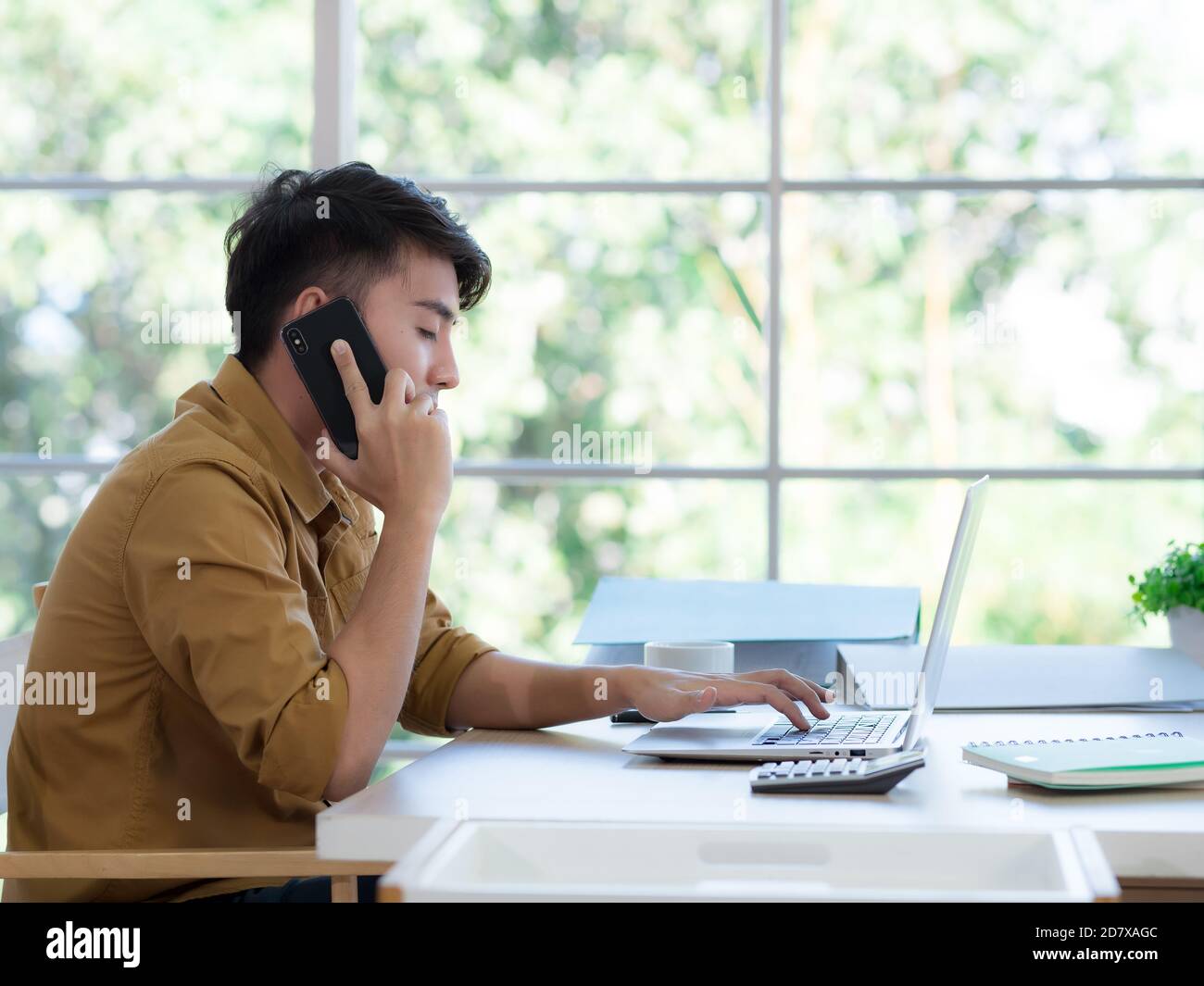 Asia man working at home Stock Photo - Alamy