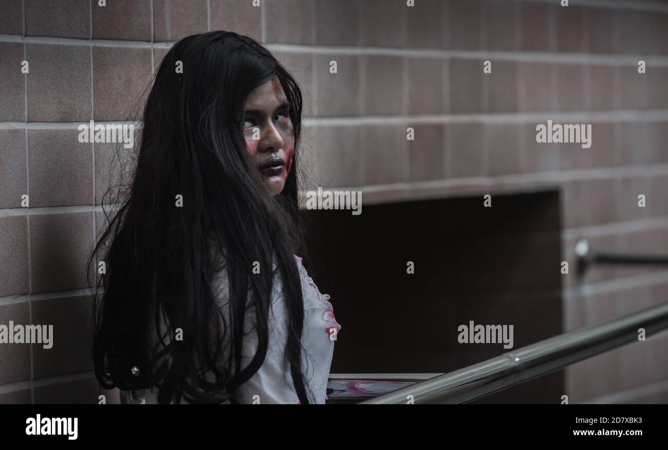 Horror evil woman ghost creepy in a dark room at house. Female zombie ...