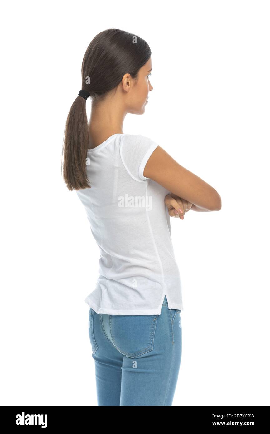 Back side view casual woman holding hands folded while standing on ...