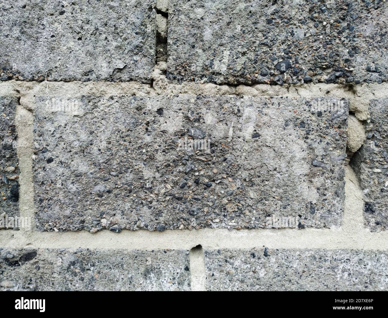Close-up cinder block in the wall. Gray Porous Brick. Place for the ...