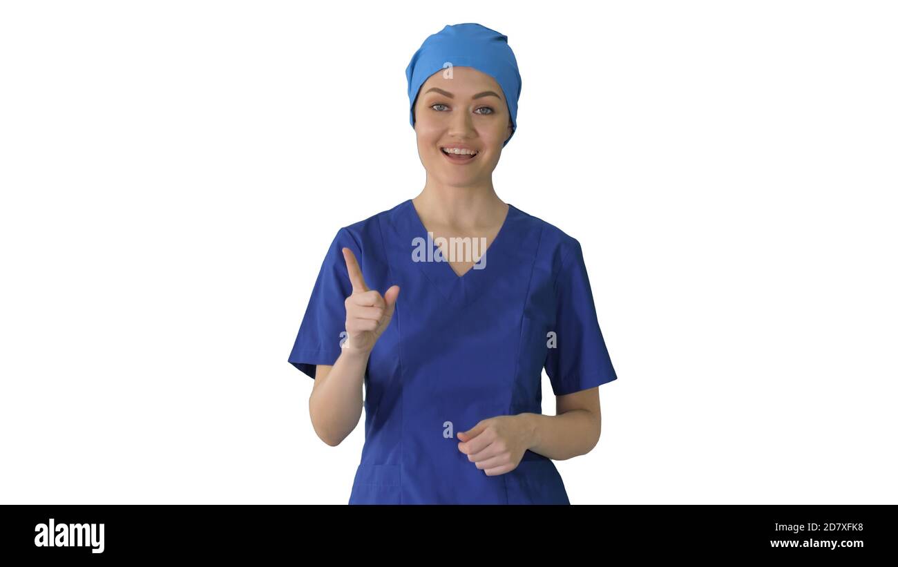 Smiling female in blue medical uniform advertising clinic servic Stock ...