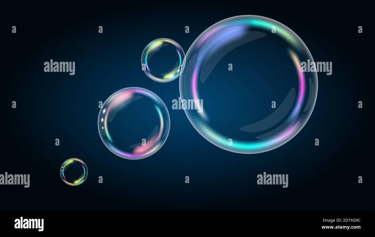 Rainbow soap bubbles on a dark background with copy space. Large and ...
