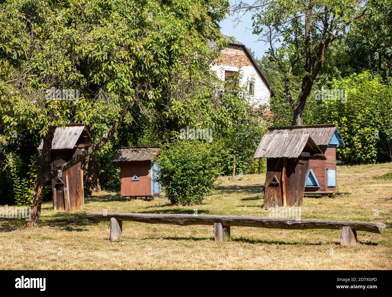 An apiary with old wooden hives in a rural garden Stock Photo - Alamy