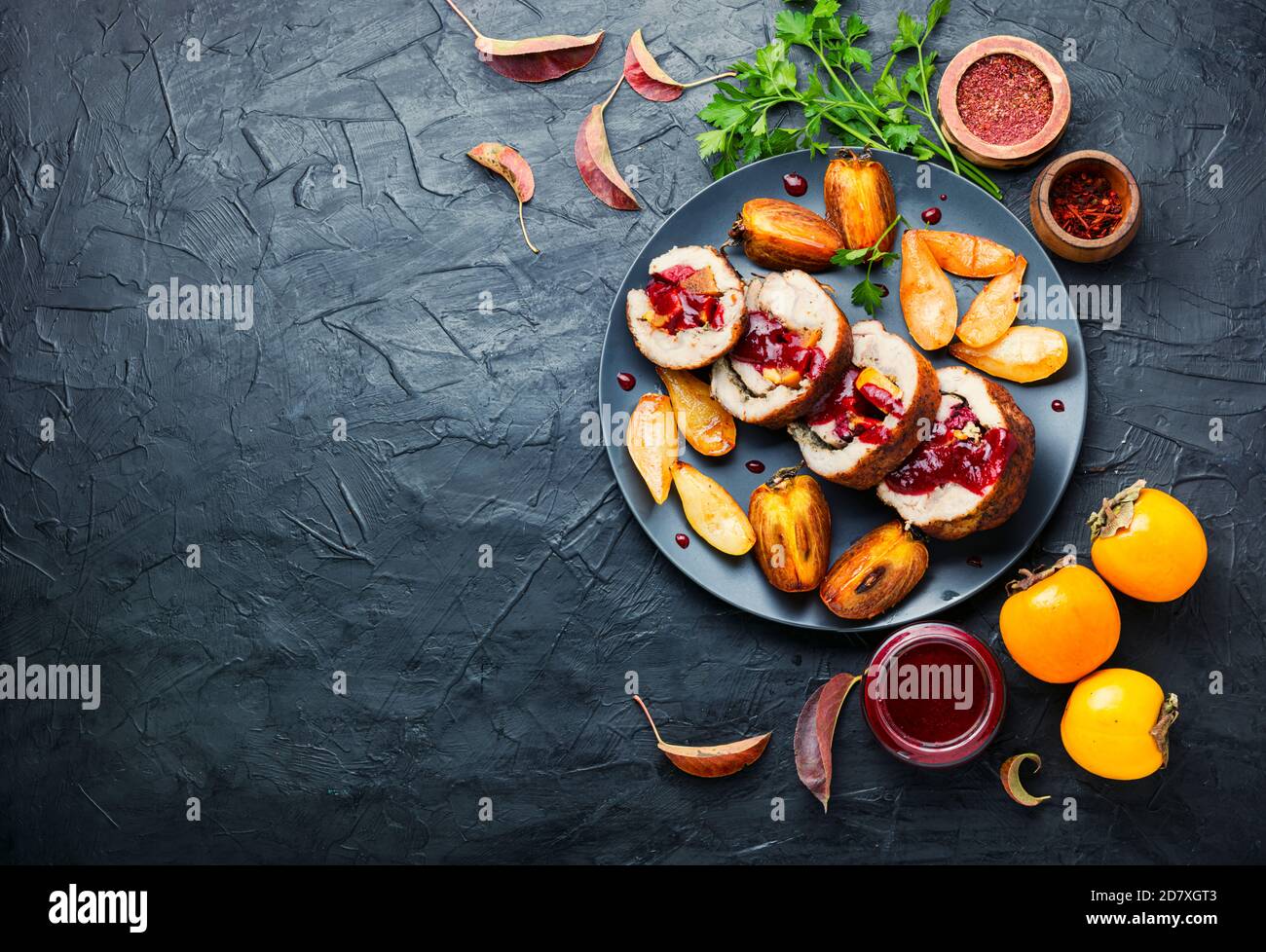 Baked pork roll with autumn persimmon.Meat stuffed with fruits Stock ...