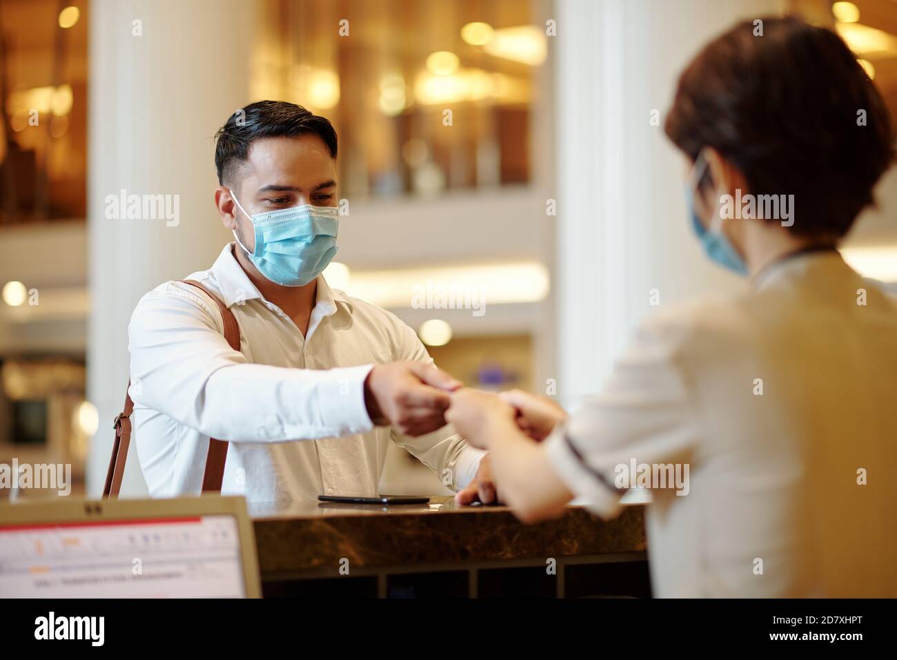 Receptionist giving key guest hi-res stock photography and images - Alamy