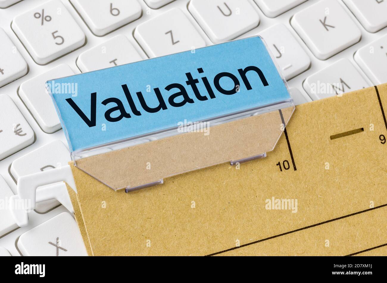 A brown file folder labeled with Valuation Stock Photo - Alamy