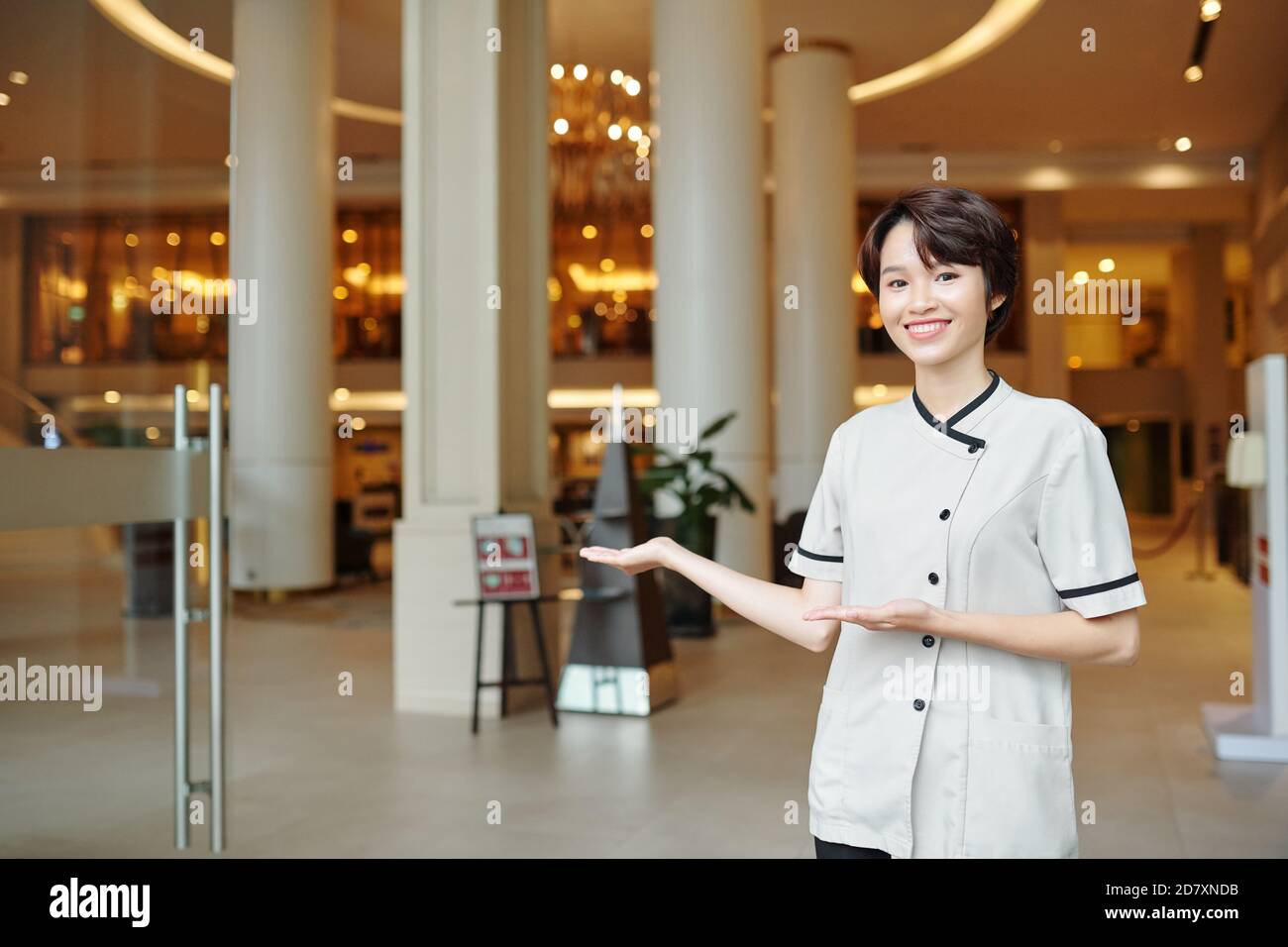 Welcoming guests inside hotel Stock Photo - Alamy