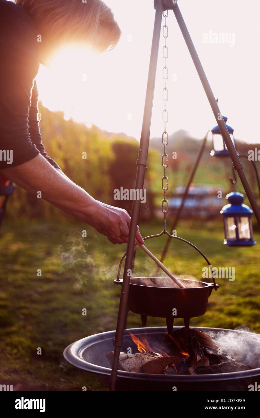 Spicy chorizo stew cooking over fire pit Stock Photo - Alamy