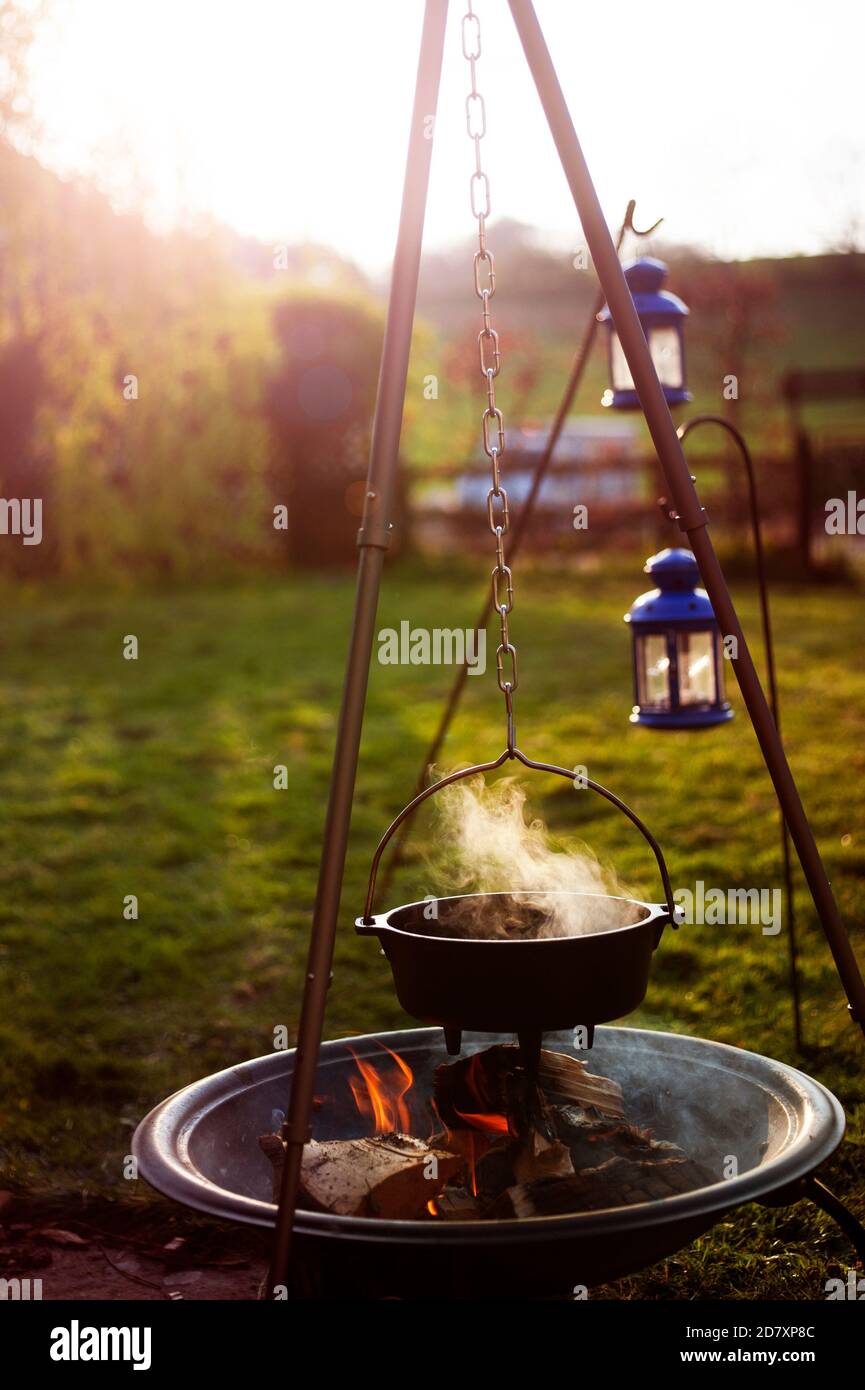 Spicy chorizo stew cooking over fire pit Stock Photo - Alamy