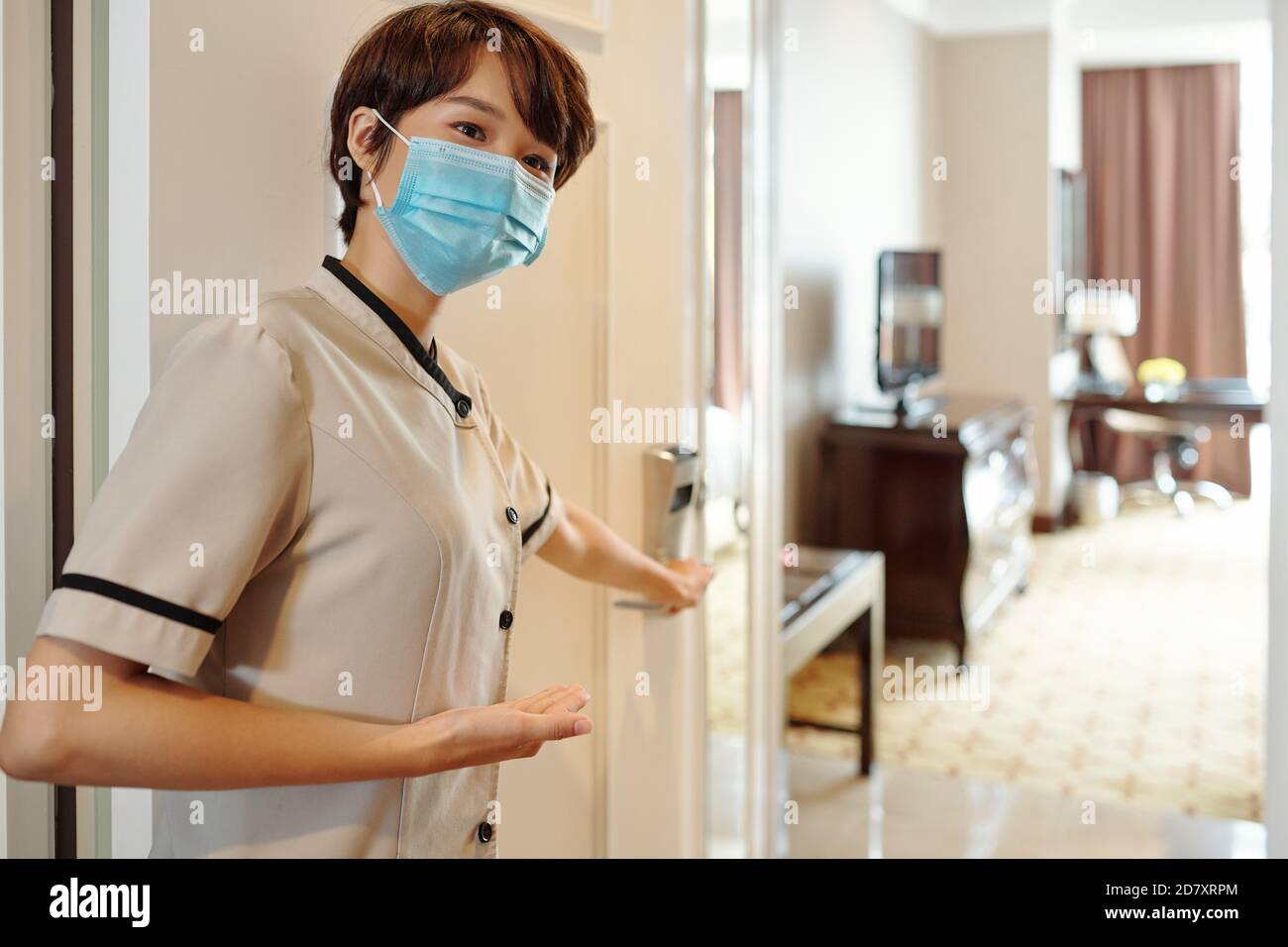 Inviting guest inside Stock Photo - Alamy