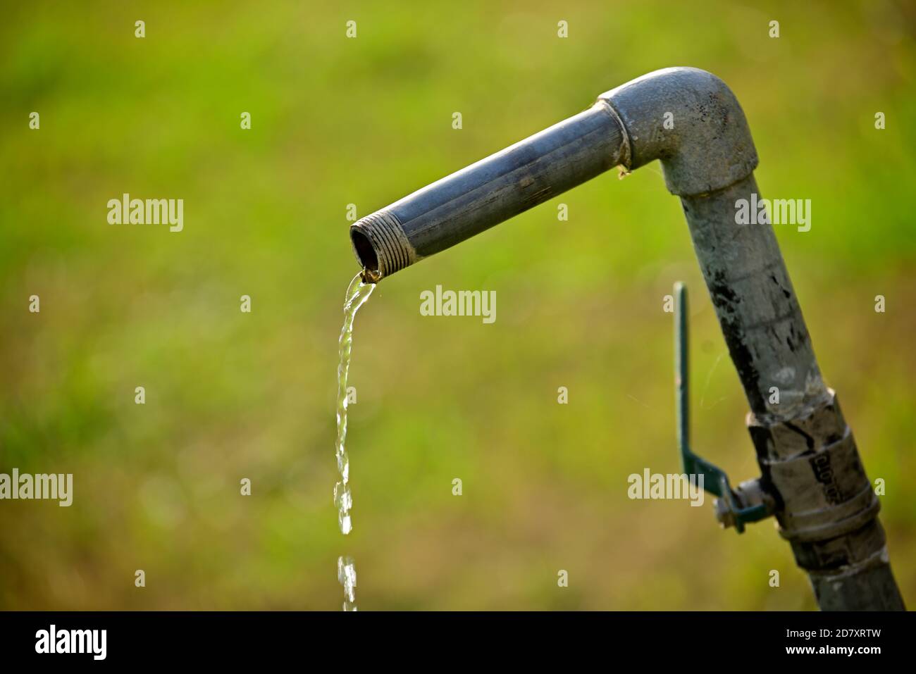 Fresh water flowing out from a steel pipe Stock Photo - Alamy