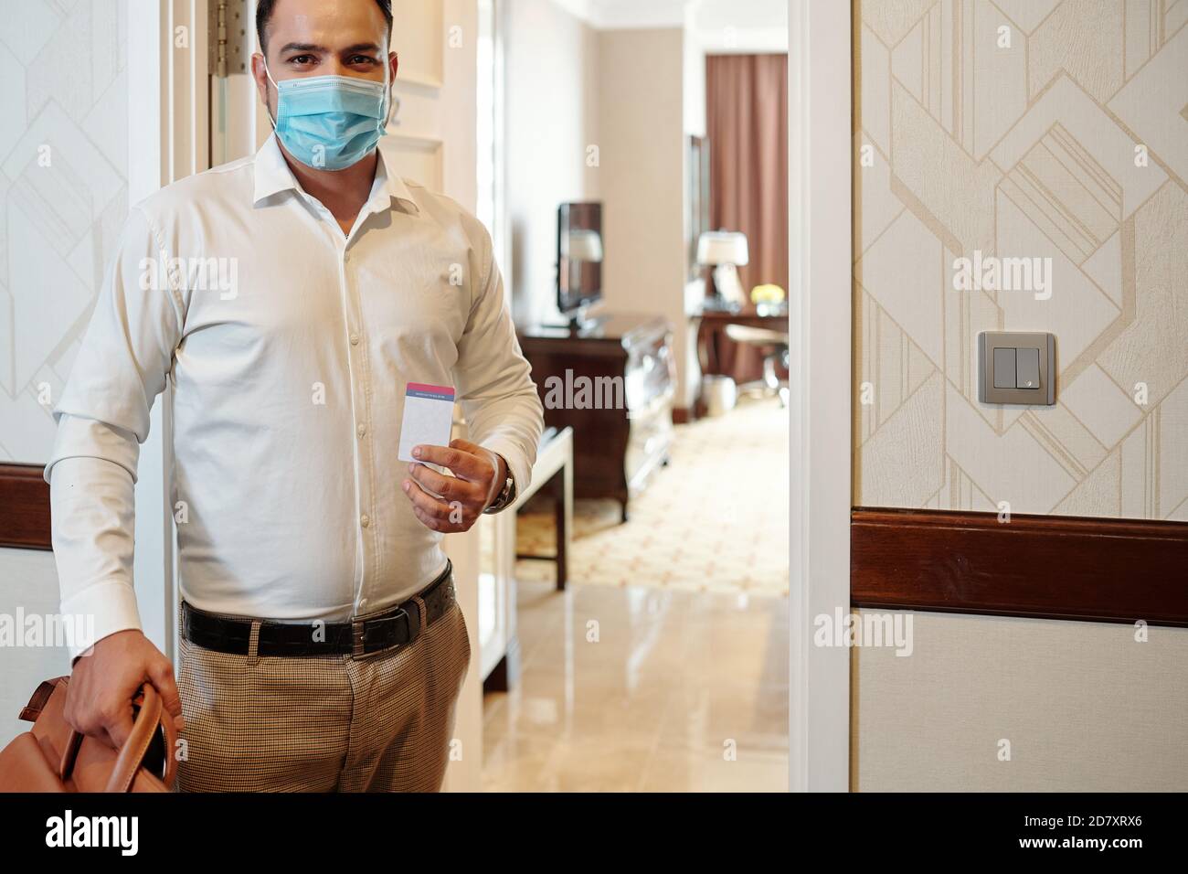 Guest standing in hotel room Stock Photo - Alamy