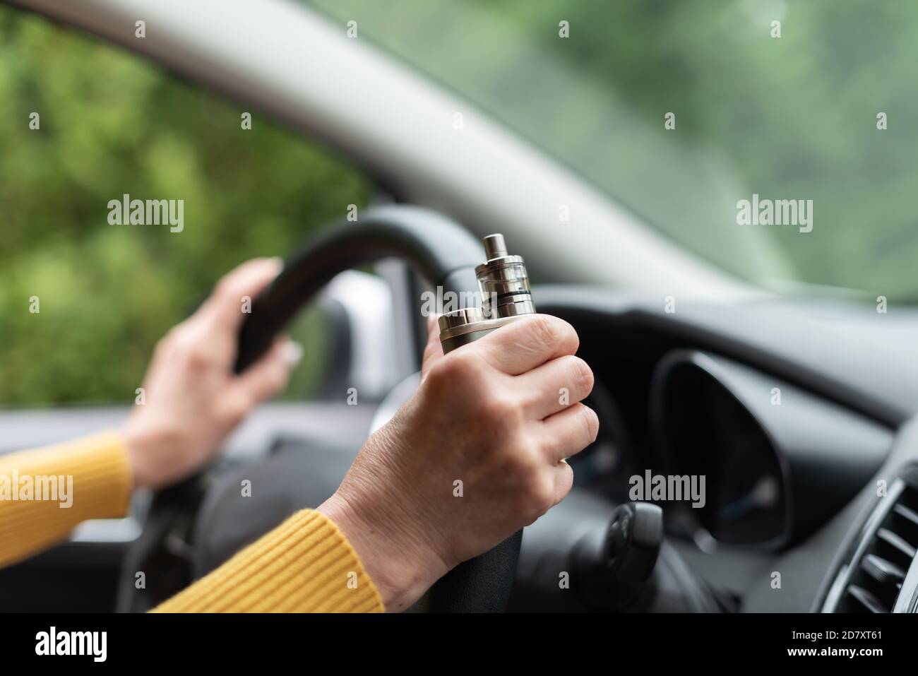 Woman smoking cigarette driving hi-res stock photography and images - Alamy