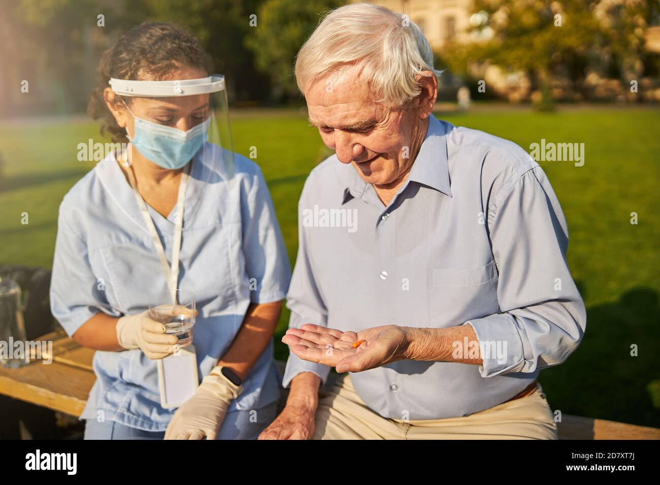 Old patient taking cure from a female doctor Stock Photo - Alamy