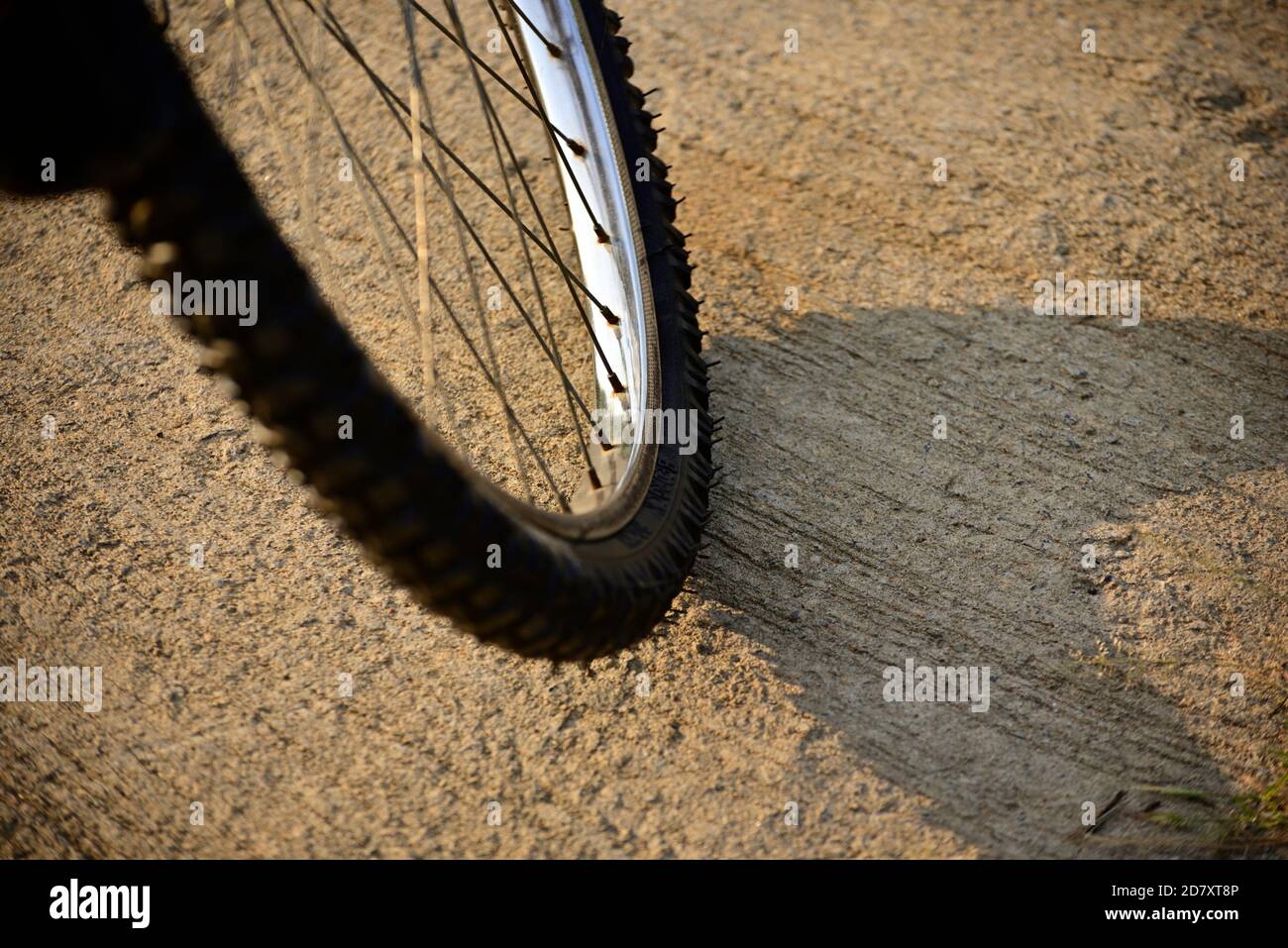 A view of the wheel of bicycle on road and the shadow Stock Photo - Alamy