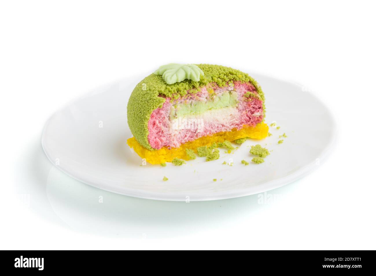 Green mousse cake with pistachio and strawberry cream isolated on white ...