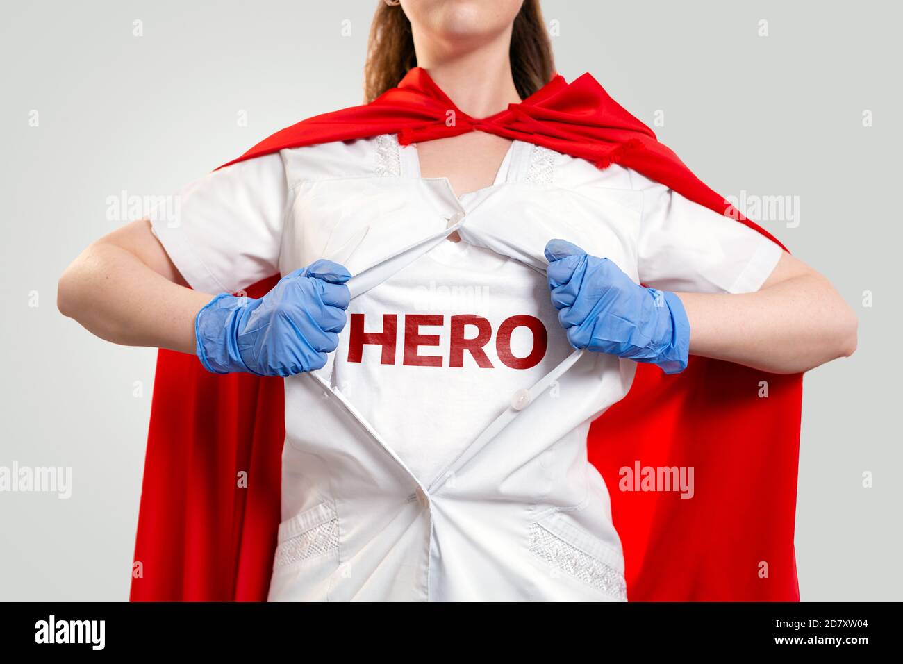 The doctor, wearing gloves and a superhero Cape, tears open the coat ...