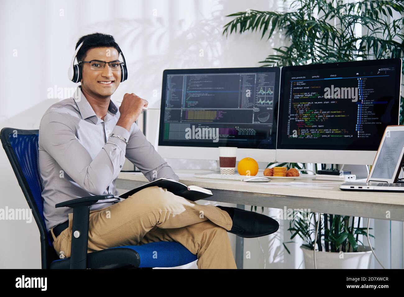 Smiling confident Indian coder Stock Photo - Alamy