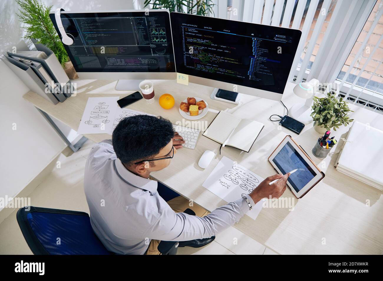 Software developer checking calendar Stock Photo - Alamy