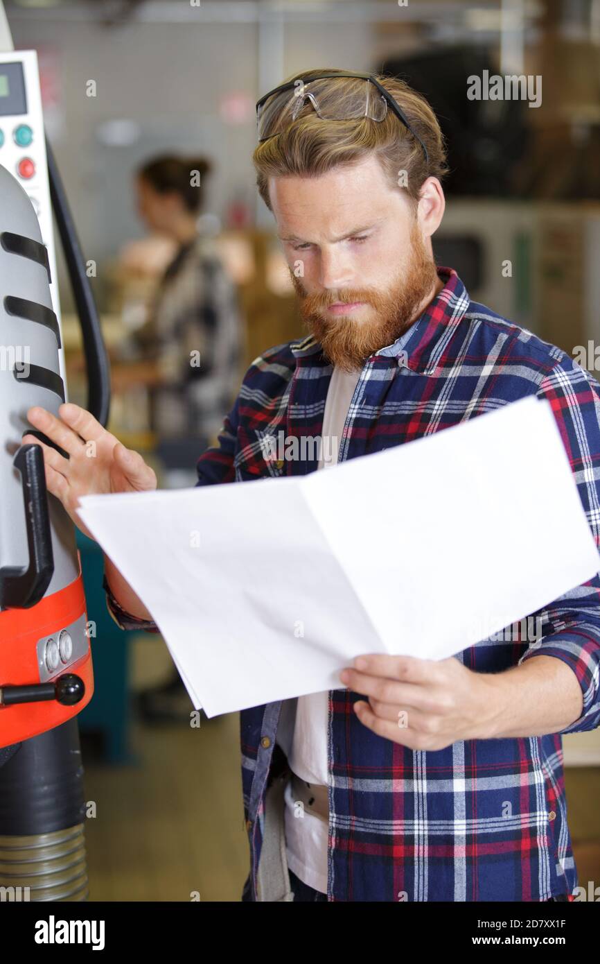 engineer is reading a drawing Stock Photo - Alamy