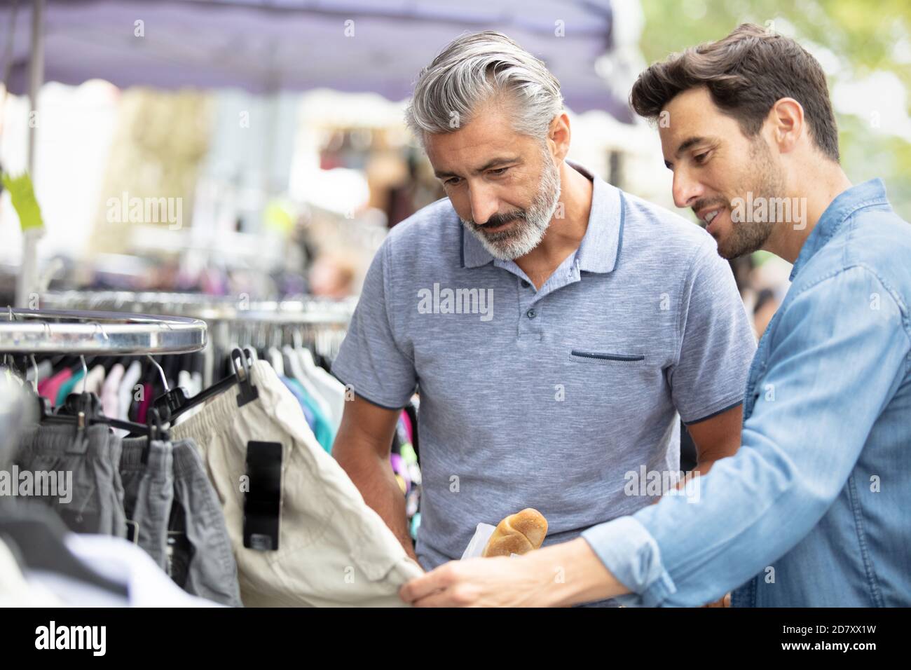men are shopping in a clothes market Stock Photo - Alamy