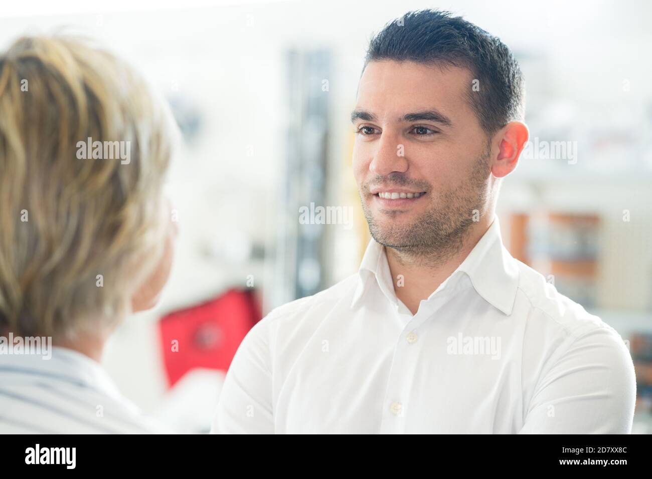 marketing adviser talking to a client Stock Photo - Alamy