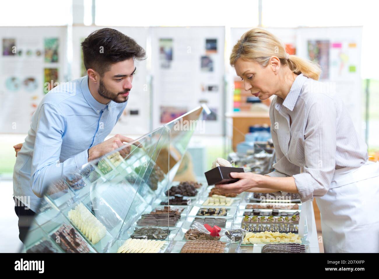 man buying bar of chocolate Stock Photo - Alamy