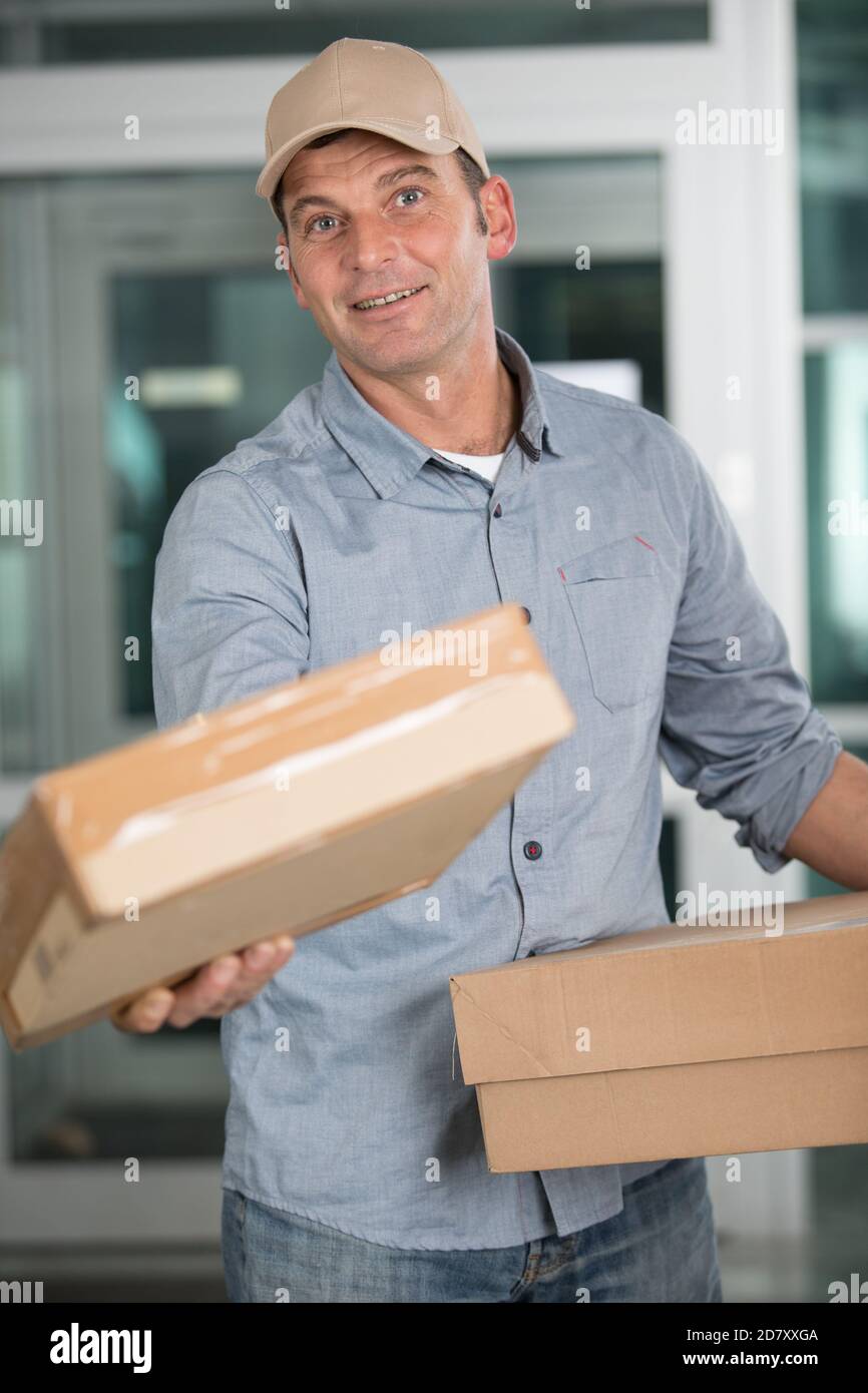 Courier parcels in car hi-res stock photography and images - Alamy