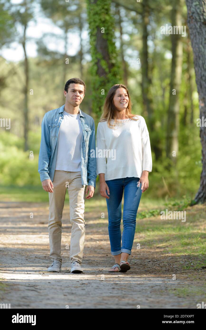 couple on a walk in forest Stock Photo - Alamy