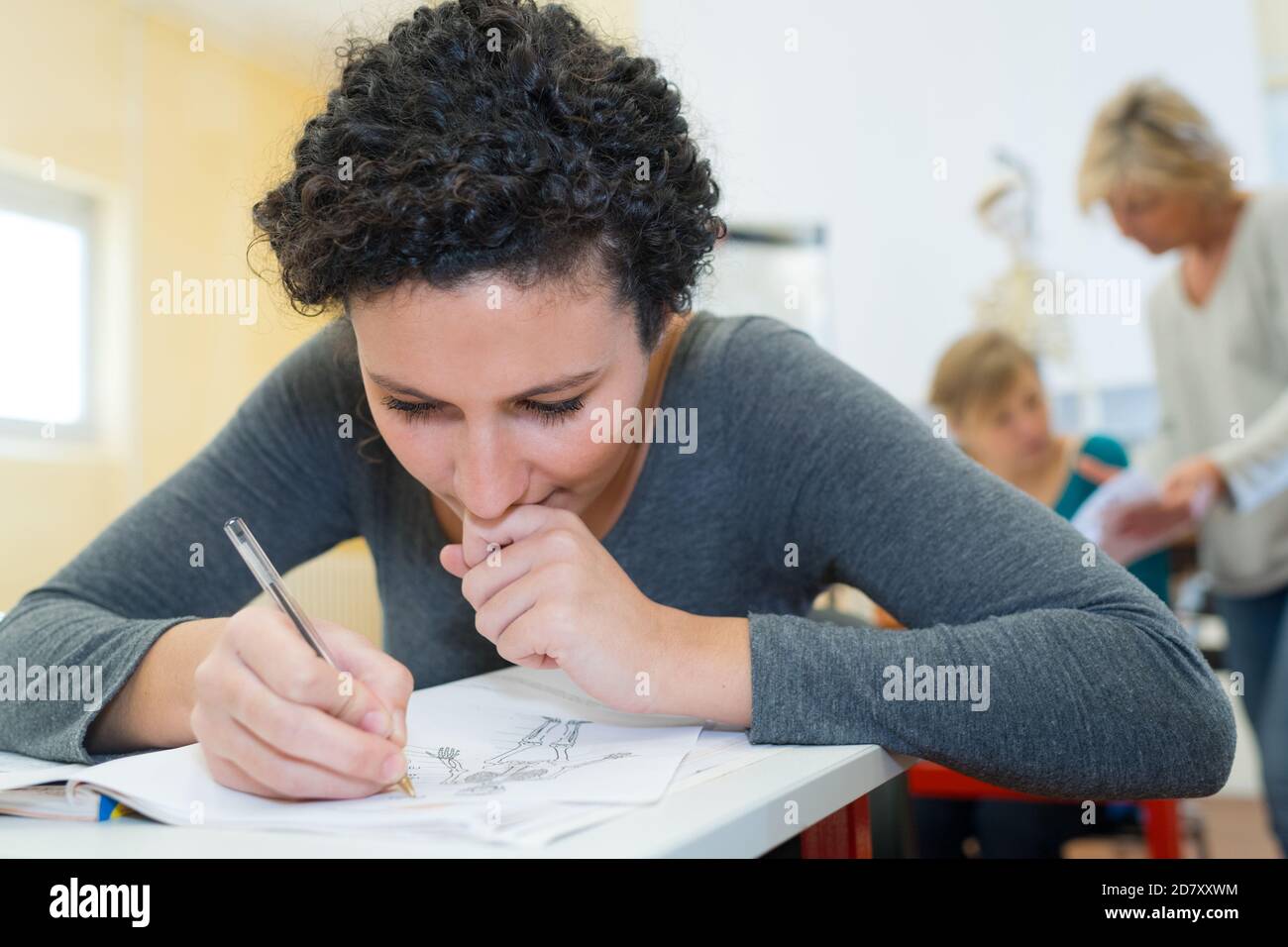 an university student attending examination Stock Photo - Alamy
