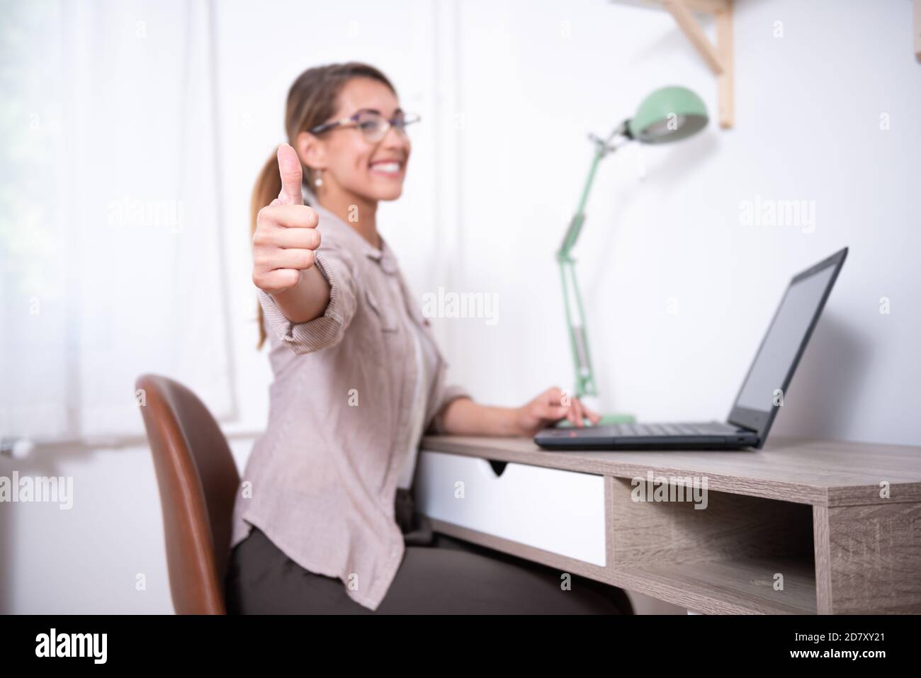 Modern young woman working remotely from home Stock Photo - Alamy