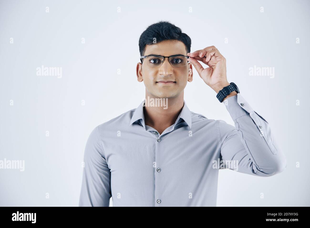 Software developer putting on glasses Stock Photo - Alamy