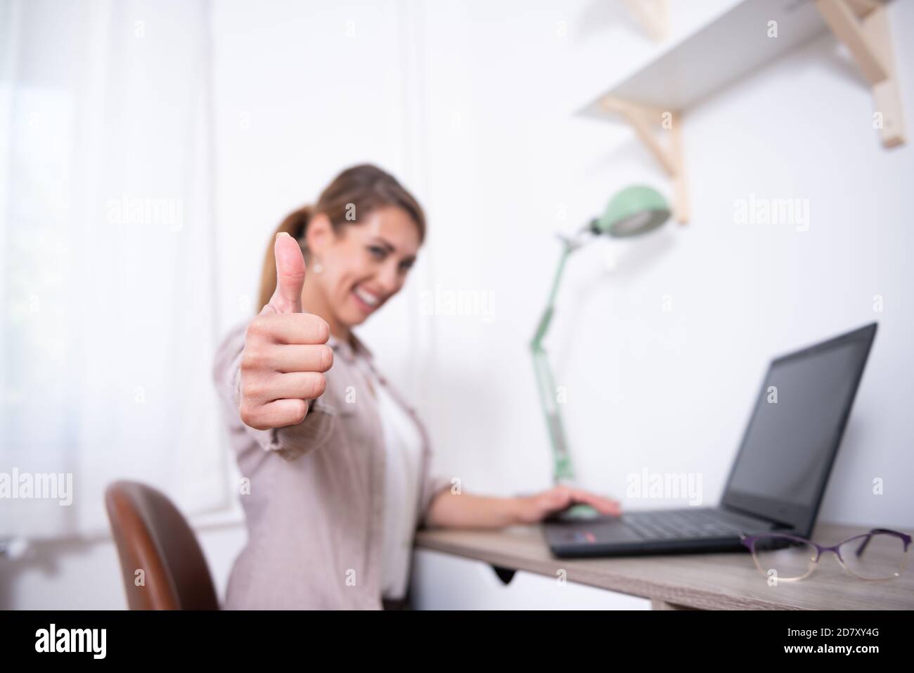 Modern young woman working remotely from home Stock Photo - Alamy