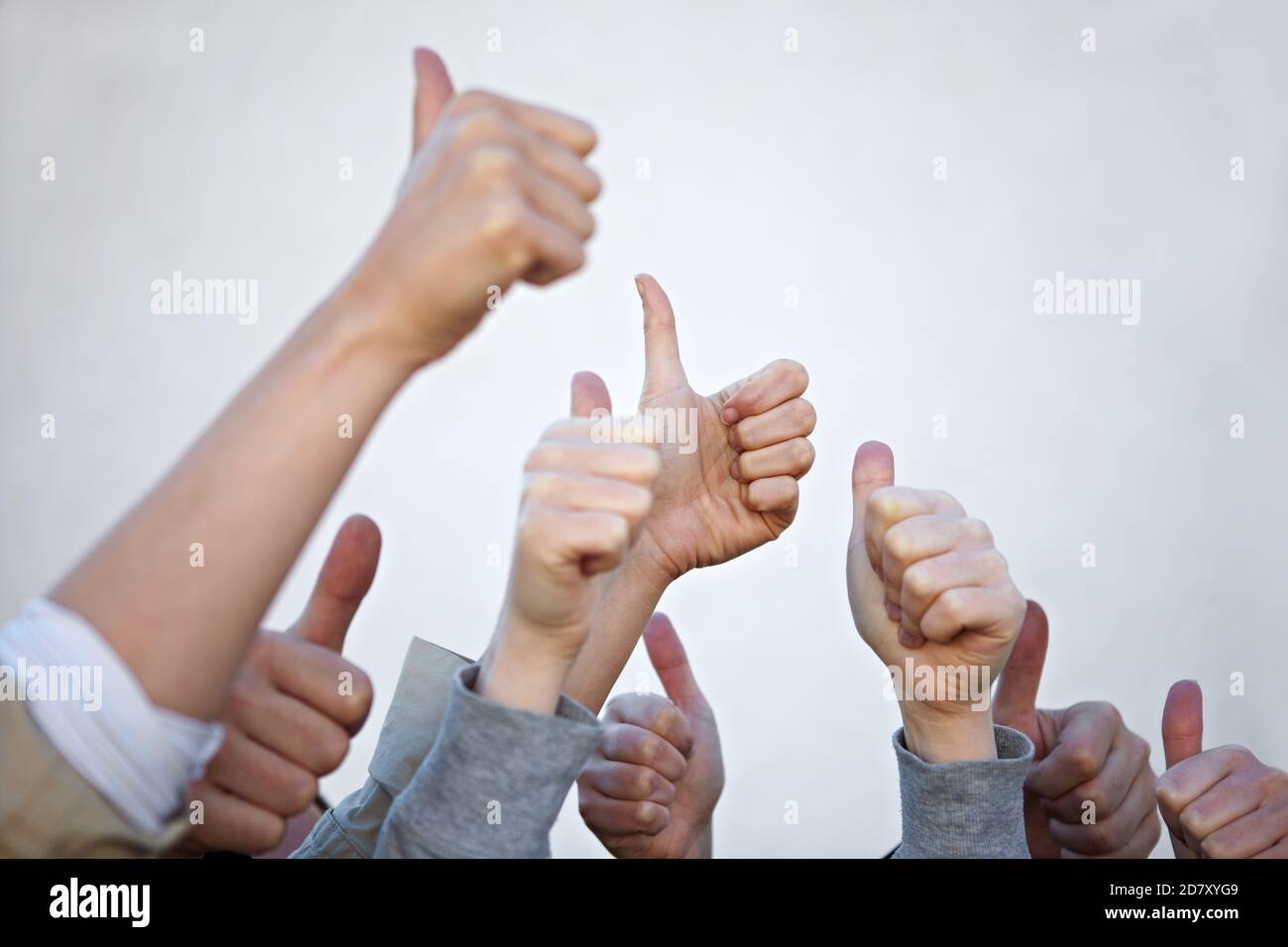 Many different thumbs are pointing up Stock Photo - Alamy