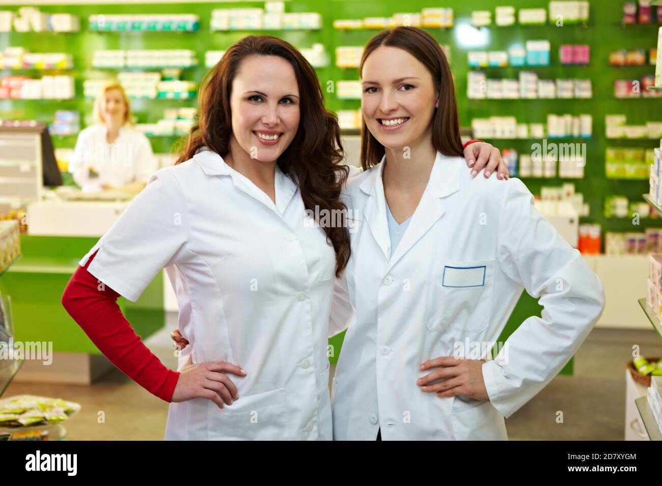 Two laughing pharmacists are happy in a pharmacy Stock Photo - Alamy