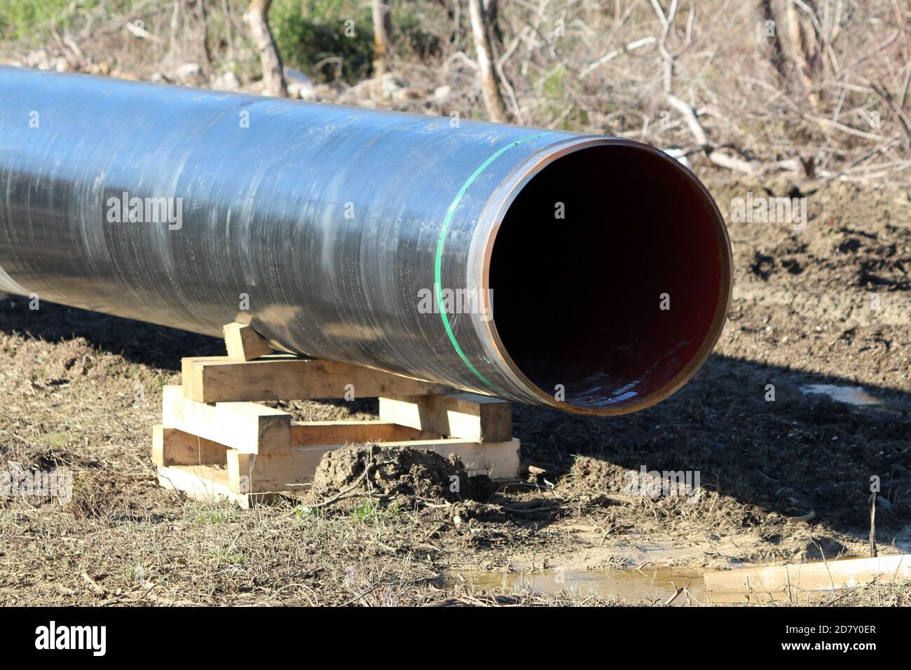 Large diameter pipe at local oil pipeline construction site supported ...
