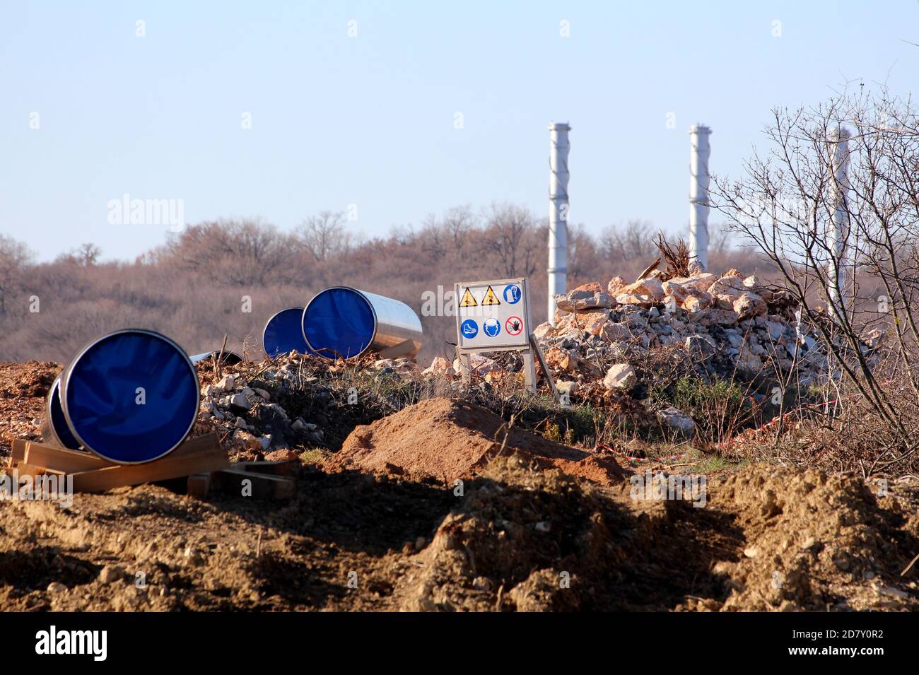 Oil pipeline construction site with large diameter pipes left over ...