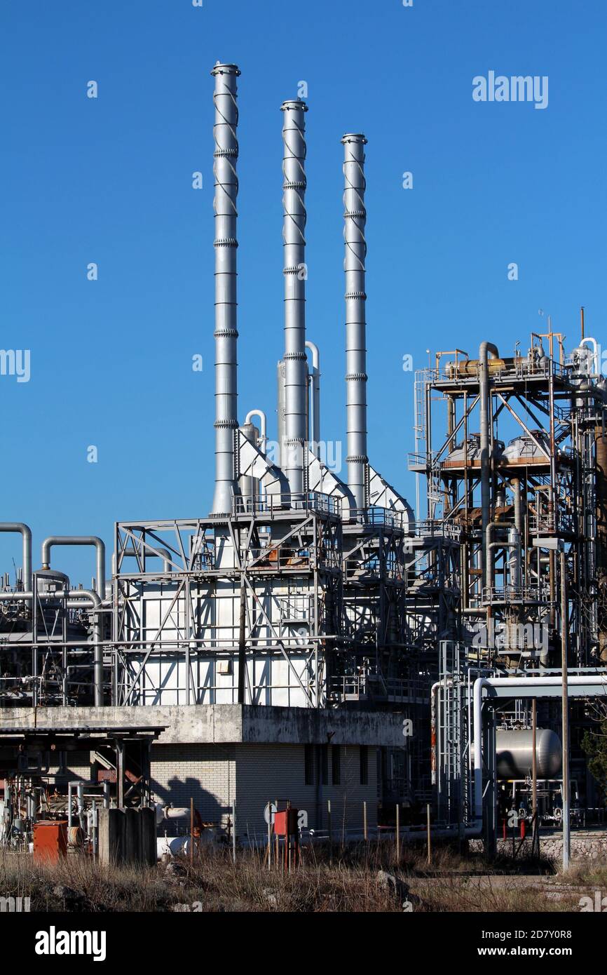 Old partially renovated and modernized oil refinery industrial complex ...