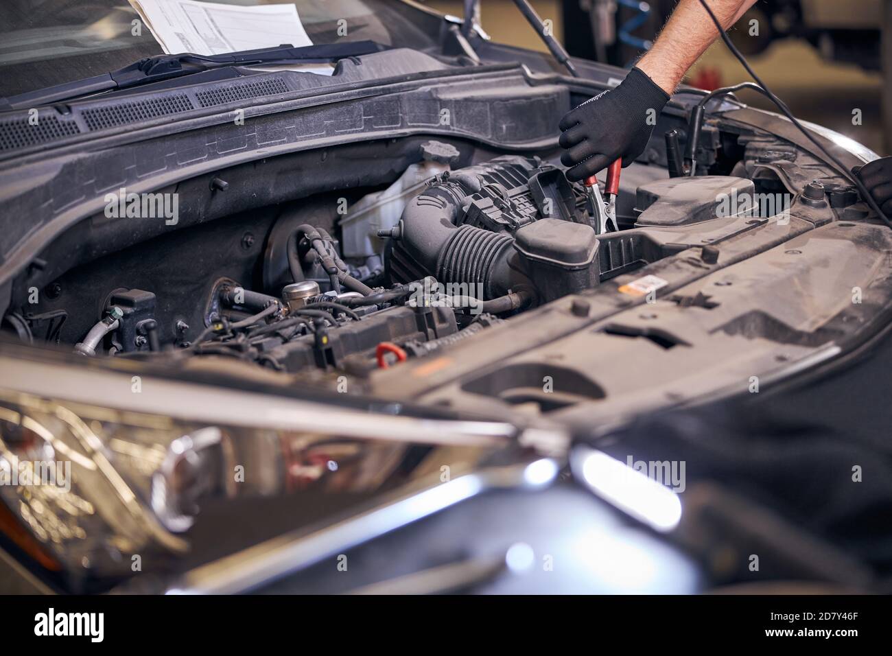 Male worker repairing car engine at service station Stock Photo - Alamy