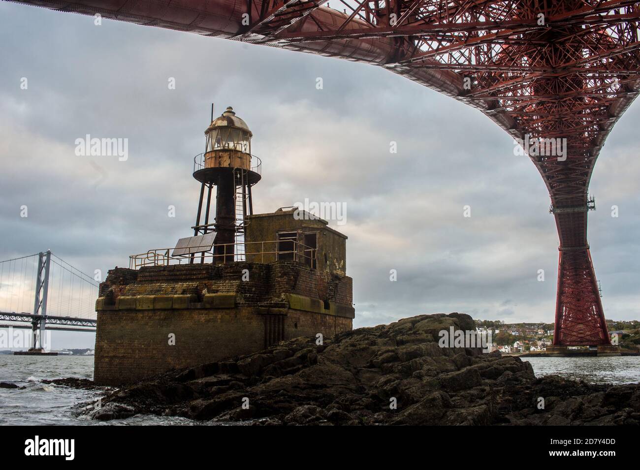 Views of Inchgarvie lighthouse and the Forth rail bridge in the Firth ...