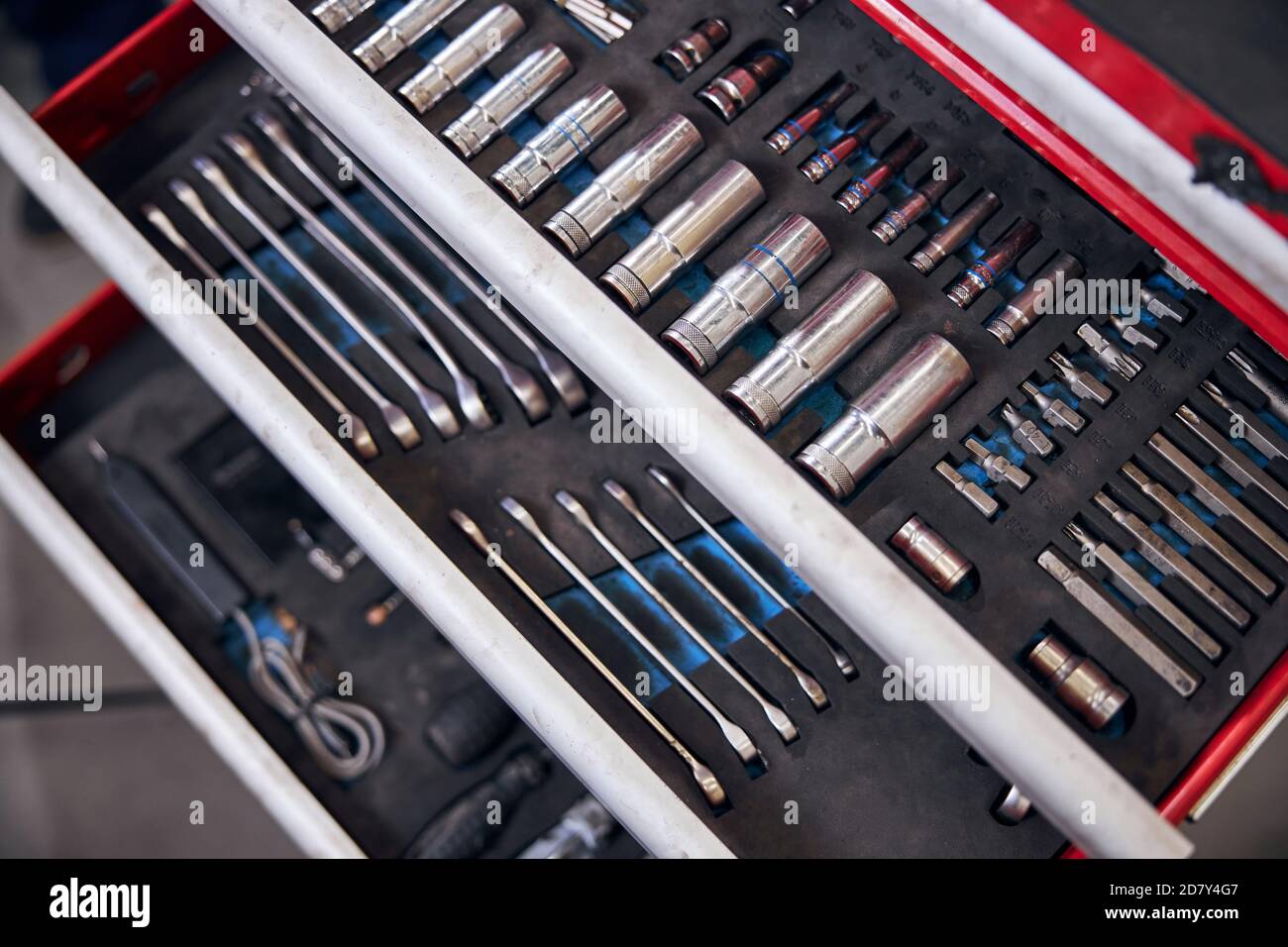 Set of professional car repairing tools in garage Stock Photo - Alamy