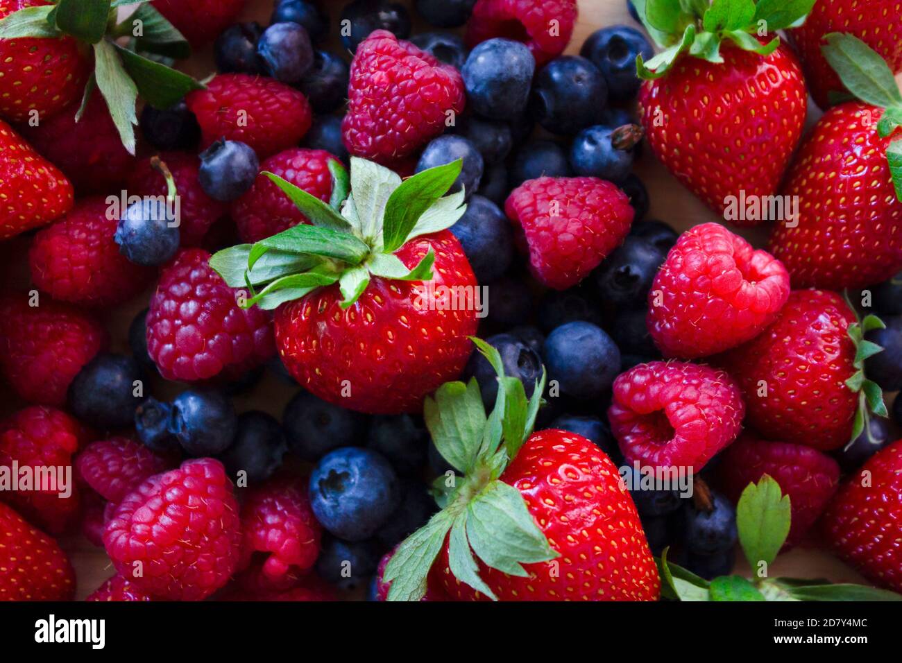 Fresh Strawberry, blueberry and raspberry.Colorful fresh forest fruits ...