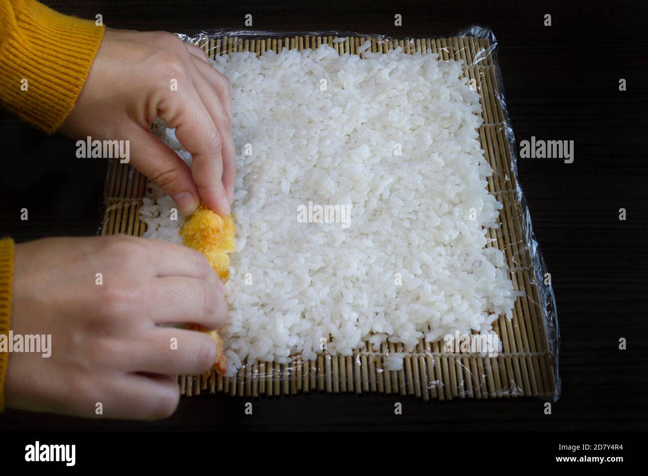 Women chef hands cooking sushi .Preparation of a sushi roll.Japanese ...