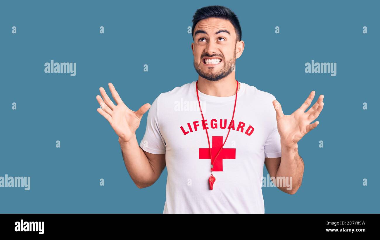 Young hispanic man lifeguard arms hi-res stock photography and images ...
