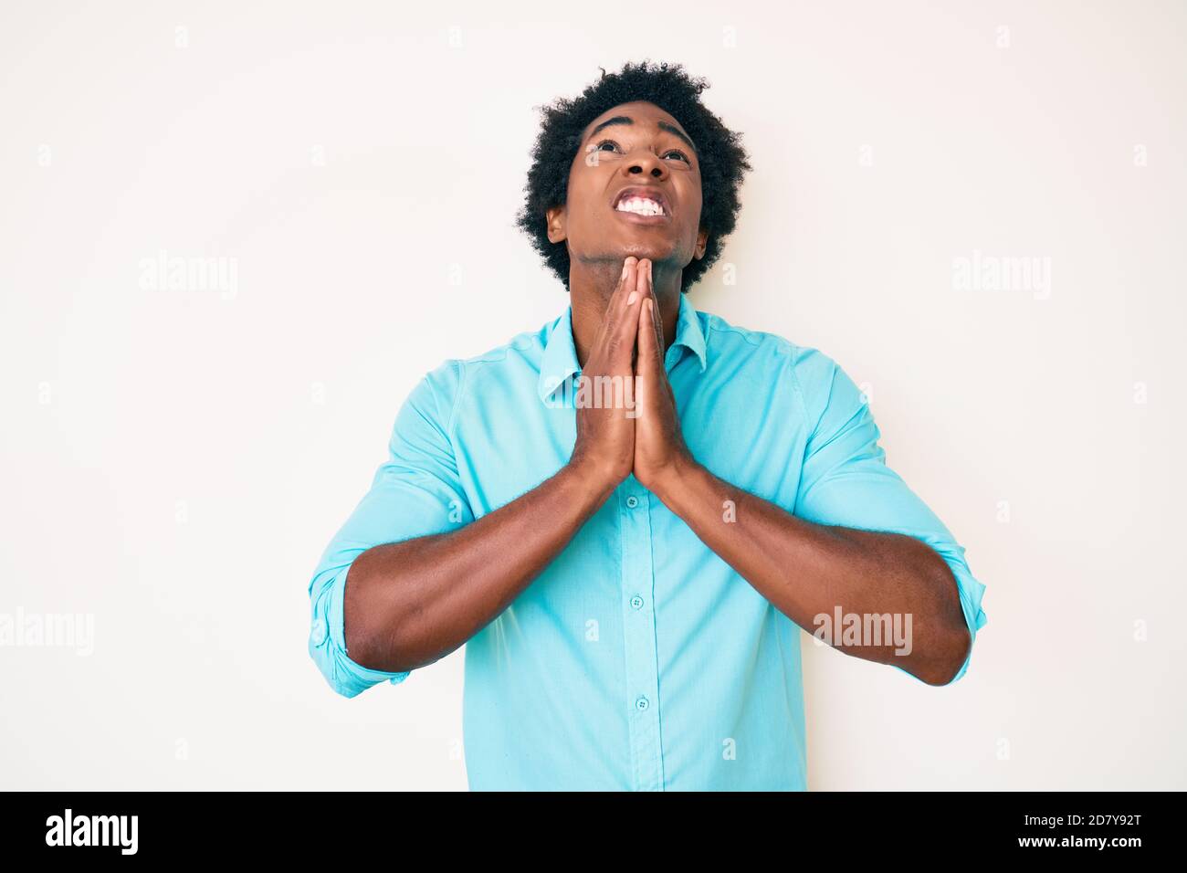Handsome african american man with afro hair wearing casual clothes ...