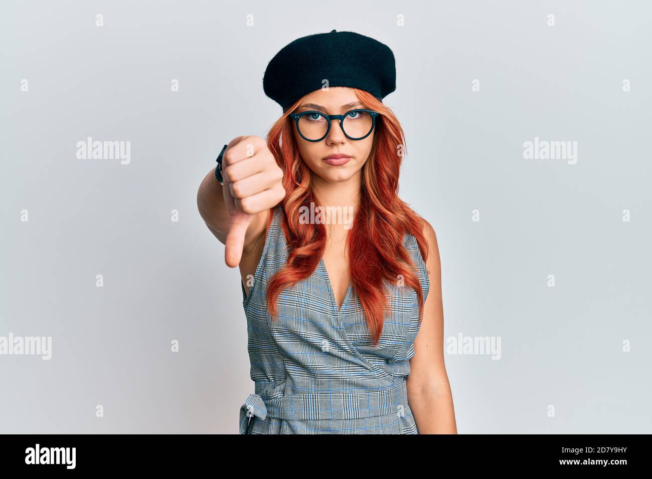 Young redhead woman wearing fashion french look with beret looking ...