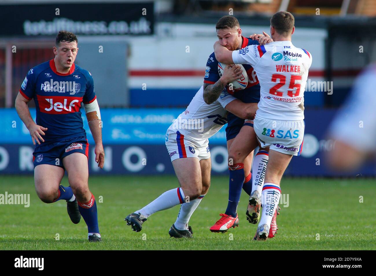 Jamie Ellis (30) of Hull KR tackled around the head by Brad Walker of ...