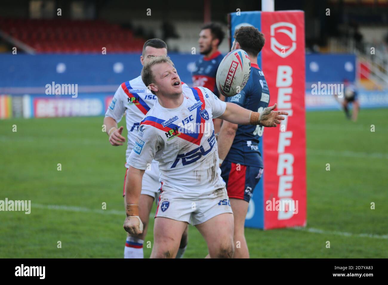 CELEBRATION - Eddie Battye of Wakefield Trinity celebrates scoring his ...